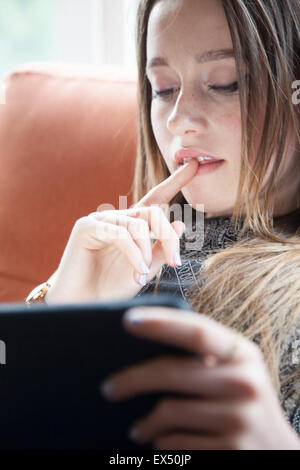 teenage girl holding tablet pc with login form on screen isolated on ...
