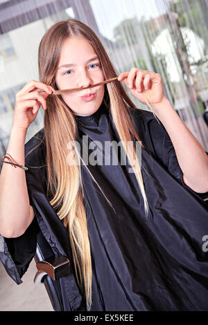 young girl in the hairdressers shop Stock Photo - Alamy