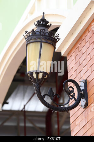a vintage victorian streetlamp or lantern outside of an historic house ...