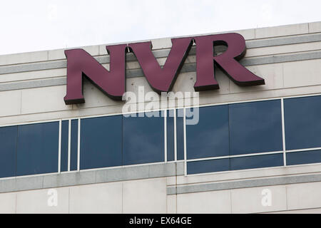 A logo sign outside of the headquarters of NVR, Inc., the parent ...