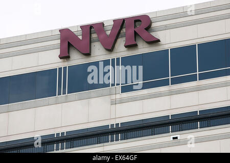 A logo sign outside of the headquarters of NVR, Inc., the parent ...