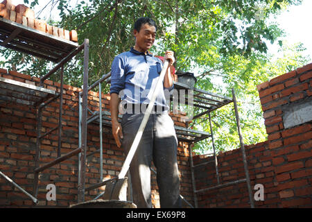Bricklayers at construction site Stock Photo - Alamy