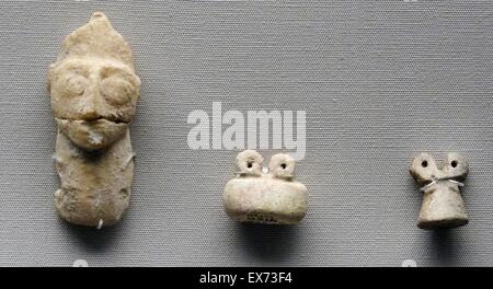 Sumerian stone head and eye figurines made of glazed faience and clay ...