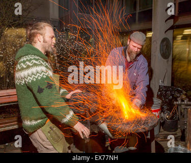 Blacksmith artist creating ironworks, Winter Festival, Reykjavik ...