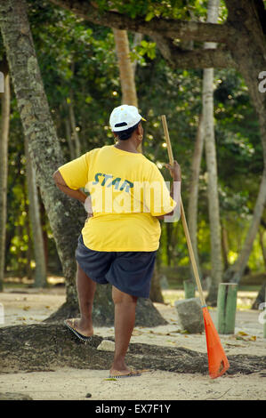 Major woman worker in a shirt with the inscription "star", Mahe Island ...