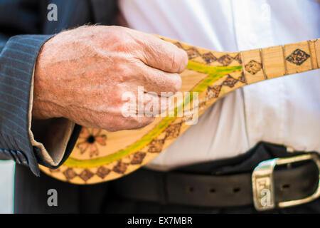 Elderly man playing a traditional cifteli instrument in Theth, Albania ...