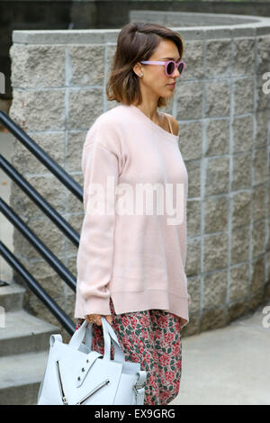 Jessica Alba arriving at a studio wearing a full length pink floral ...