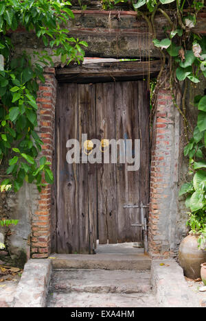 Ancient wooden gate with the inclination and decay Stock Photo - Alamy