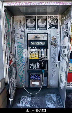 Defaced and broken payphone with graffiti, Vancouver, BC, Canada Stock ...