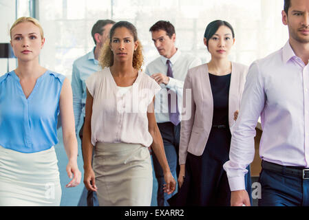 Officer workers marching in unison Stock Photo - Alamy
