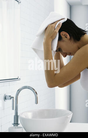 young woman drying off after a swim in a pool Stock Photo - Alamy