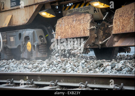 Network Rail ballast hoppers laying ballast during track maintenance on ...
