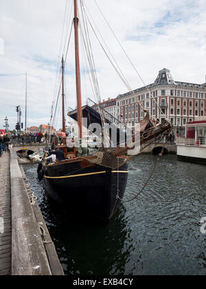 bridge opens for a traditional sailing boat in the Nyhavn harbour area ...