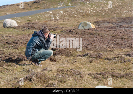 Boy taking pictures in Ireland Stock Photo - Alamy