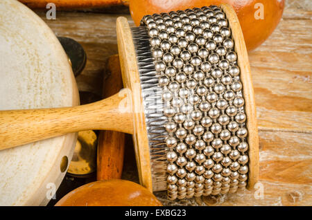 Several small percussion instruments on a rustic wooden surface Stock ...