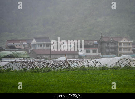 Sanmen. 11th July, 2015. Photo taken on July 11, 2015 shows farmlands ...