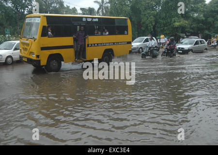 Allahabad, India. 12th July, 2015. The rain water clogged the road ...