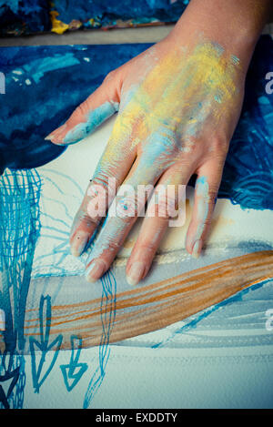 particular of woman painter hand painting in her studio Stock Photo - Alamy