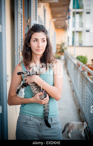 beautiful woman with cats at home Stock Photo - Alamy
