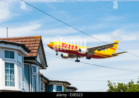 Side view of a DHL Airbus A300 cargo plane on approach to land with ...