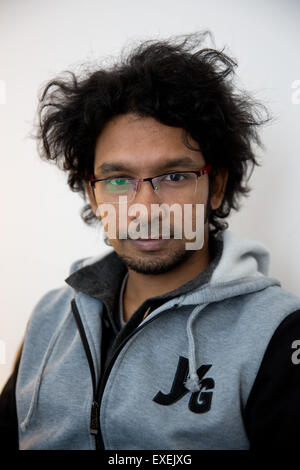 Blogger Ananya Azad from Bangladesh sits in his apartment at his laptop ...
