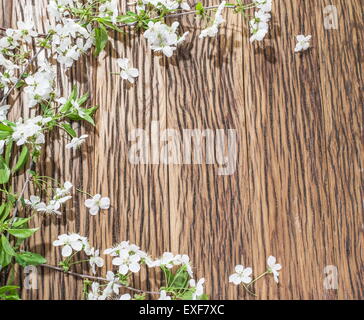 Blooming cherry twig over old wooden table Stock Photo - Alamy