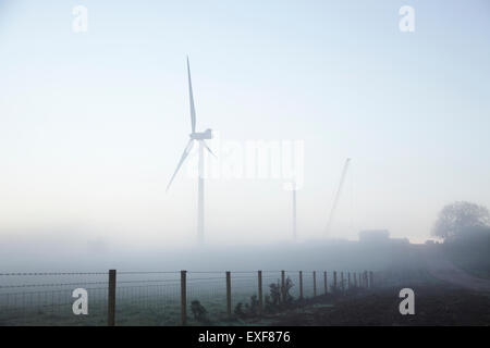 Wind turbine in mist Stock Photo - Alamy