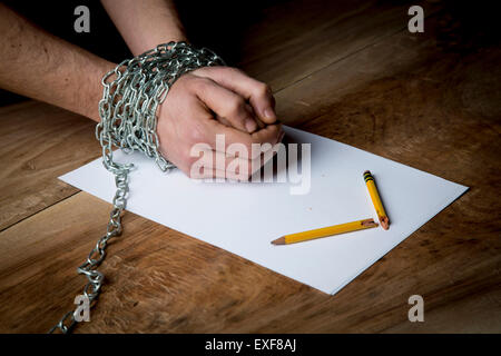 Hand with metal chains wrapped around wrist Stock Photo - Alamy