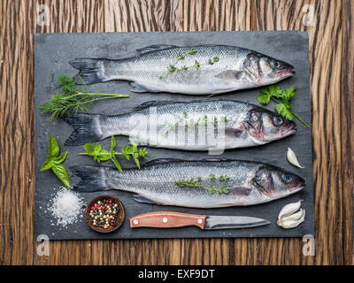 Sea bass fish on the graphite board Stock Photo - Alamy