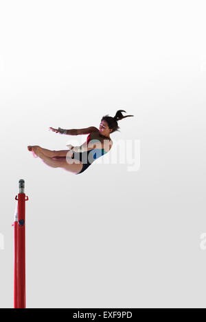 Female gymnast performing on uneven bars Stock Photo - Alamy
