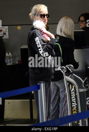 Elizabeth Whitson waits to check in to her flight at Los Angeles ...