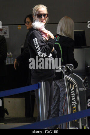 Elizabeth Whitson waits to check in to her flight at Los Angeles ...