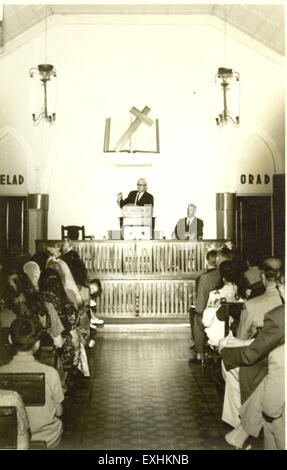 This photograph captures Nelson Litwiller speaking at a convention in ...