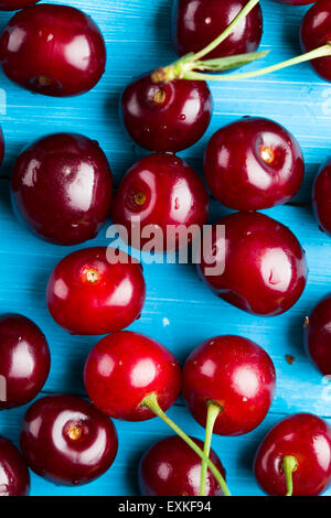 Ripe sweet cherry frame on wooden background with place for text. Flat ...