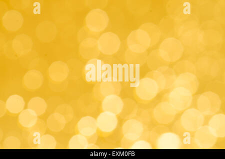 Blurred golden lights abstract background in the night, defocused dark ...