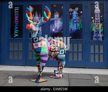 Decorated wire-framed woollen deer, 'Yarn Bombed' anaimal covered with ...