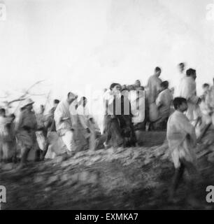 Mahatma Gandhi and others on his march through the riot stricken areas ...