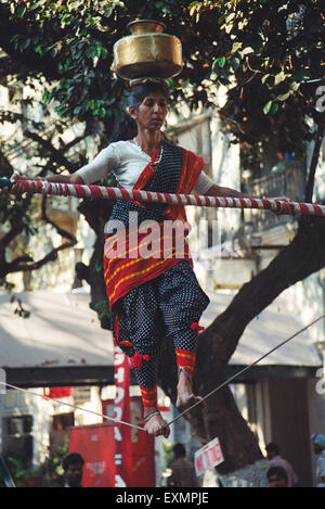 Tightrope walking, funambulism, woman walking skill on thin rope, Kala ...