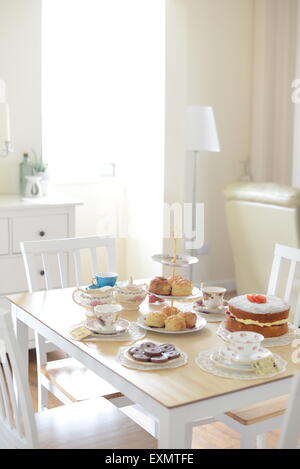 family party at the table, cake and tea Stock Photo - Alamy