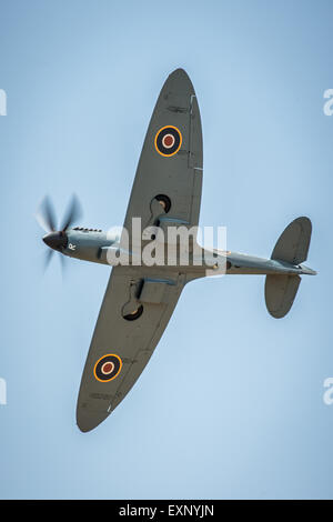 Single Spitfire flying against a blue sky, iconic image of the Battle ...