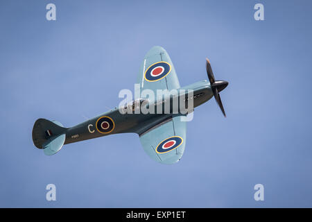 Single Spitfire flying against a blue sky, iconic image of the Battle ...