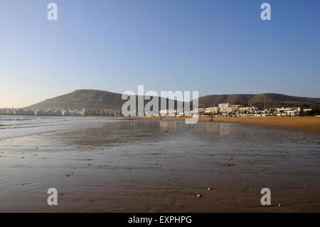 Agadir Beach and tide of Atlantic Ocean, with Kasbah and Marina in the ...