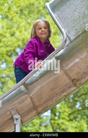 View of children's playground with slide on sunny day Stock Photo - Alamy