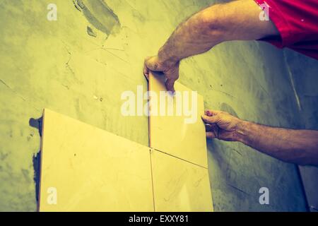 construction mason man hands on tiles work with cement mortar Stock ...