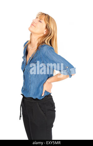 Beautiful young displeased woman with different scattered clothes ...