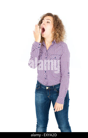 Beautiful young displeased woman with different scattered clothes ...