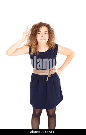 Beautiful young displeased woman with different scattered clothes ...