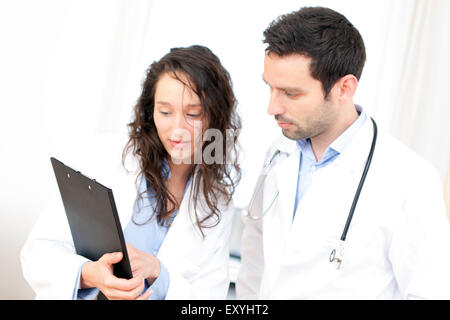 View of a Young doctor and nurse analysing radiography Stock Photo - Alamy