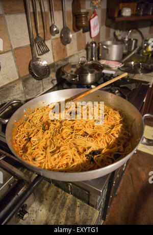 A big pan of spaghetti in the kitchen Stock Photo - Alamy