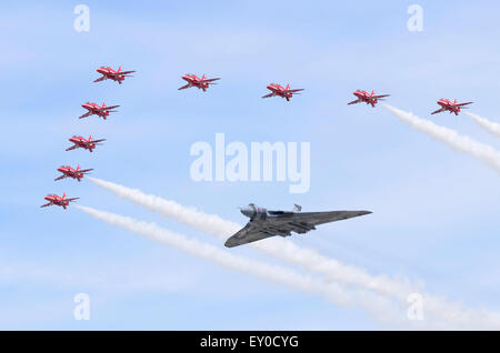 Avro Vulcan bomber and Red Arrows RAF BAe Hawk aircraft in formation at RIAT 2015, Fairford, UK ...